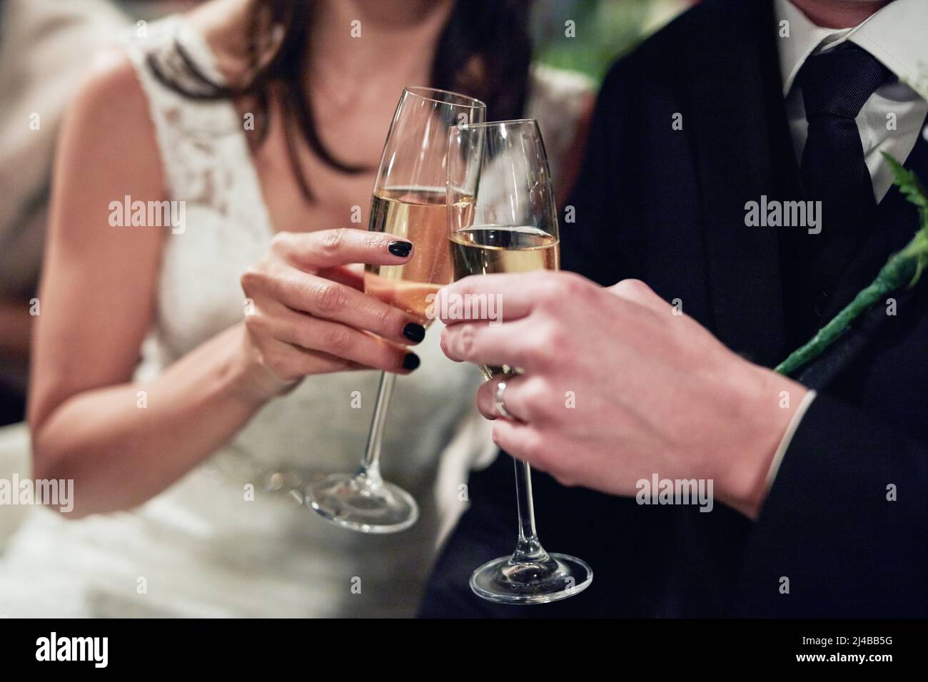 Sharing the first toast as Mr and Mrs. Cropped shot of a newlywed ...