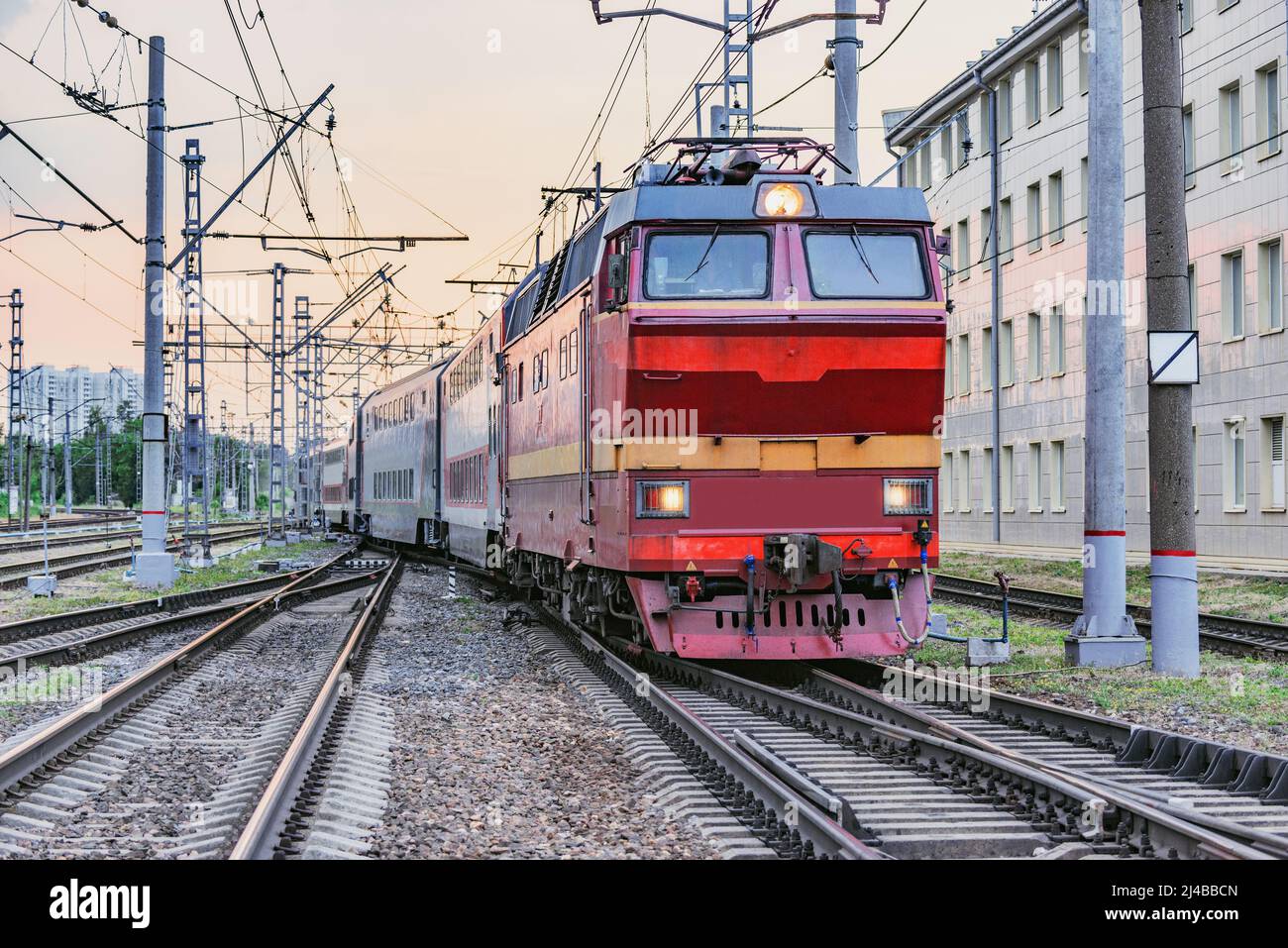 Passenger retro electric czech locomotive with train departs from the ...