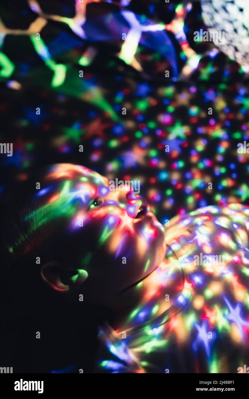 Rotation Night Light Projector Used By A Young Boy In His Bedroom ...