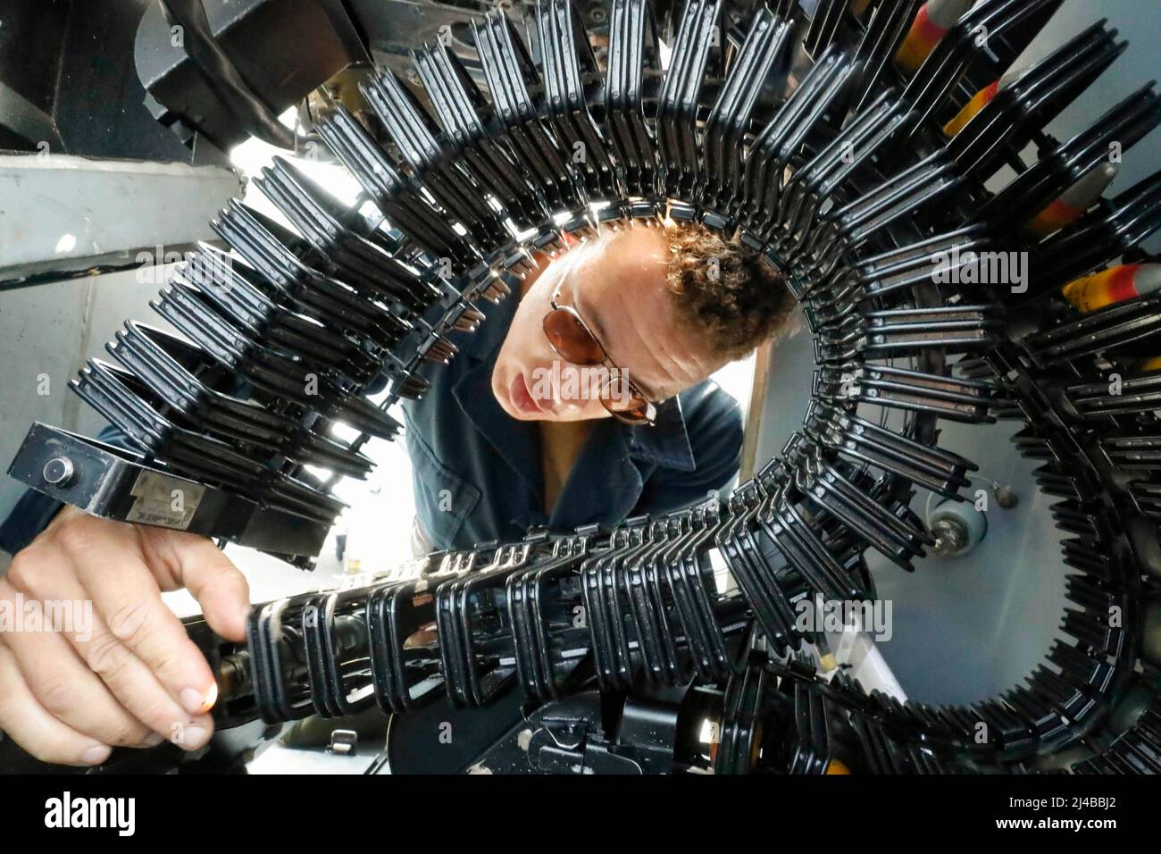At Sea. 5th Apr, 2022. Gunners Mate 3rd Class Clinton Brown loads ...
