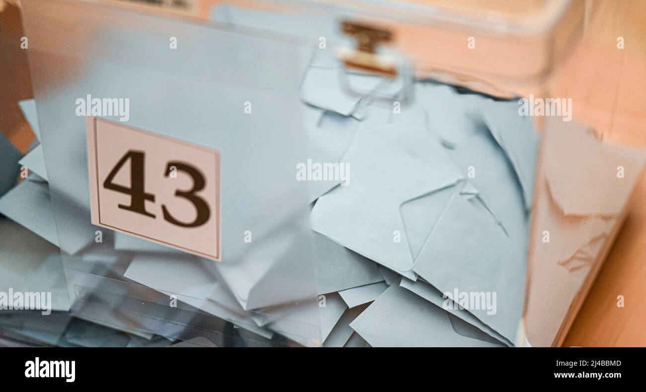 Ballot paper in their envelope placed in the ballot box Stock Photo - Alamy