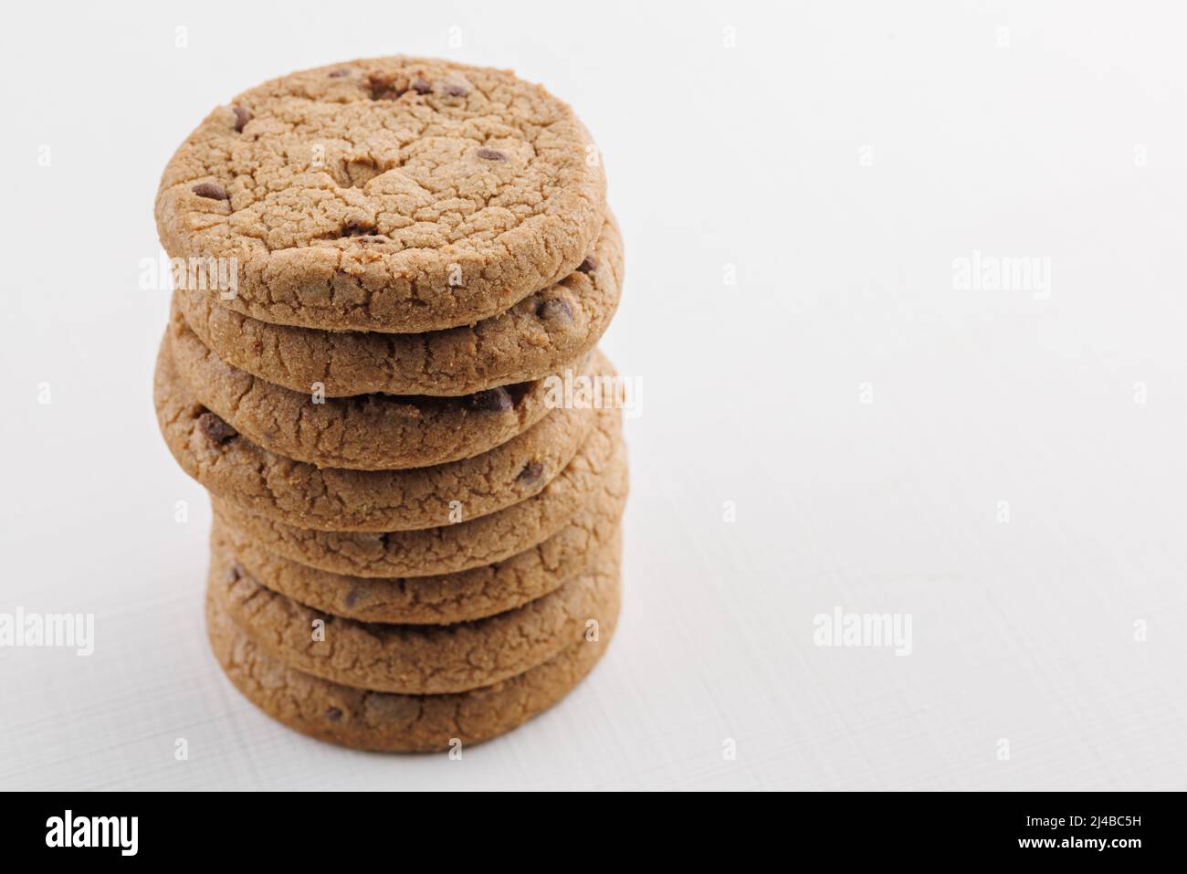 vertical stack of round chip cake cookies with chocolate on white ...