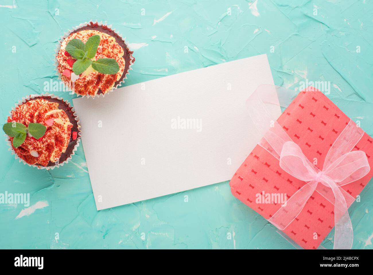 Two cakes with a gift, and with an empty space for an inscription or ...