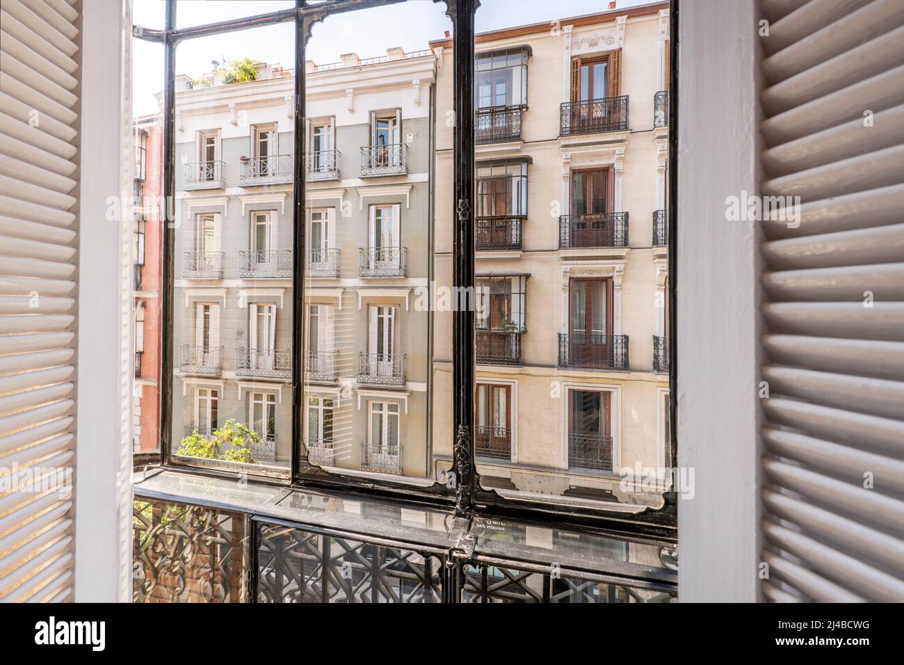 Views from a bay window to vintage buildings in the center of Madrid ...