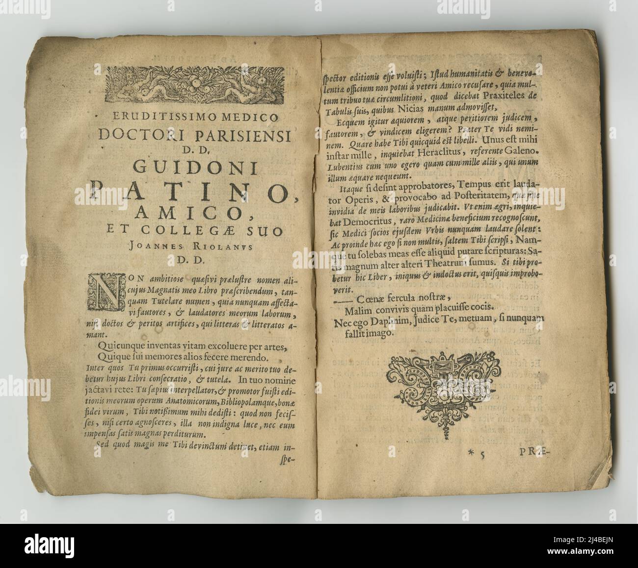 Weathered latin book. An old book with its pages on display Stock Photo ...