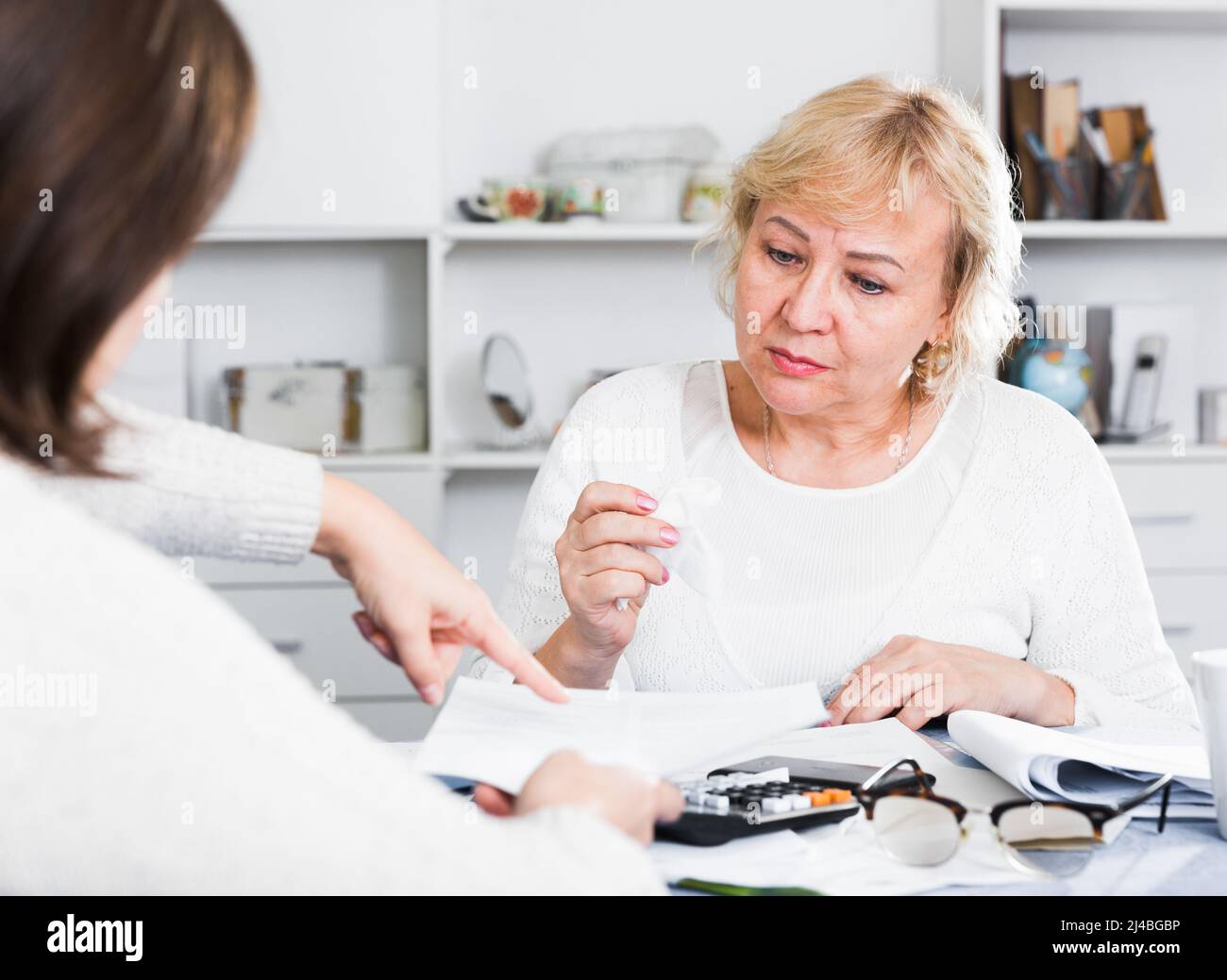 Mature woman and acccountant Stock Photo - Alamy