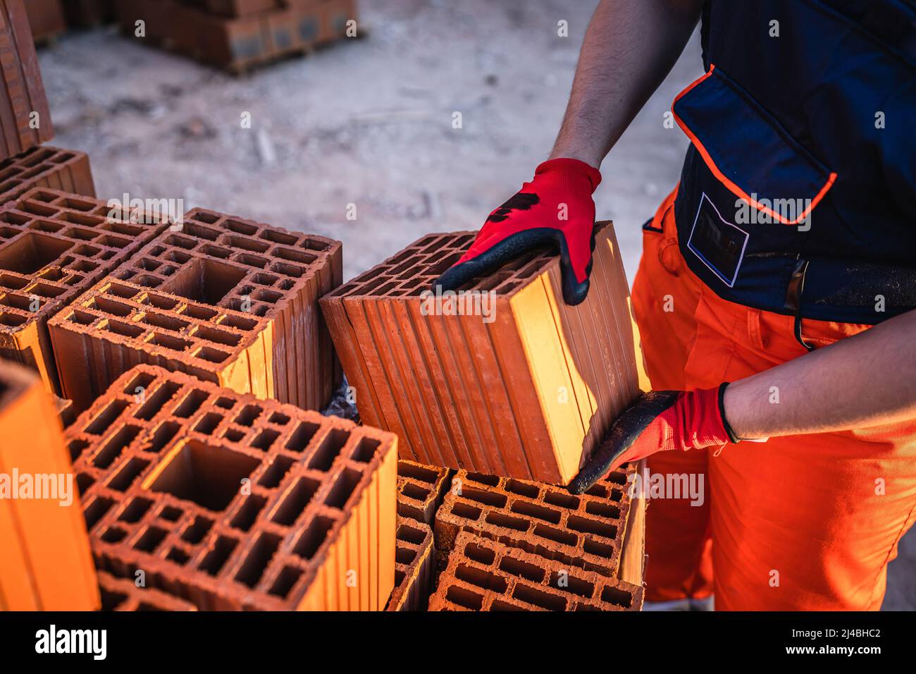 Construction worker carrying blocks hi-res stock photography and images ...