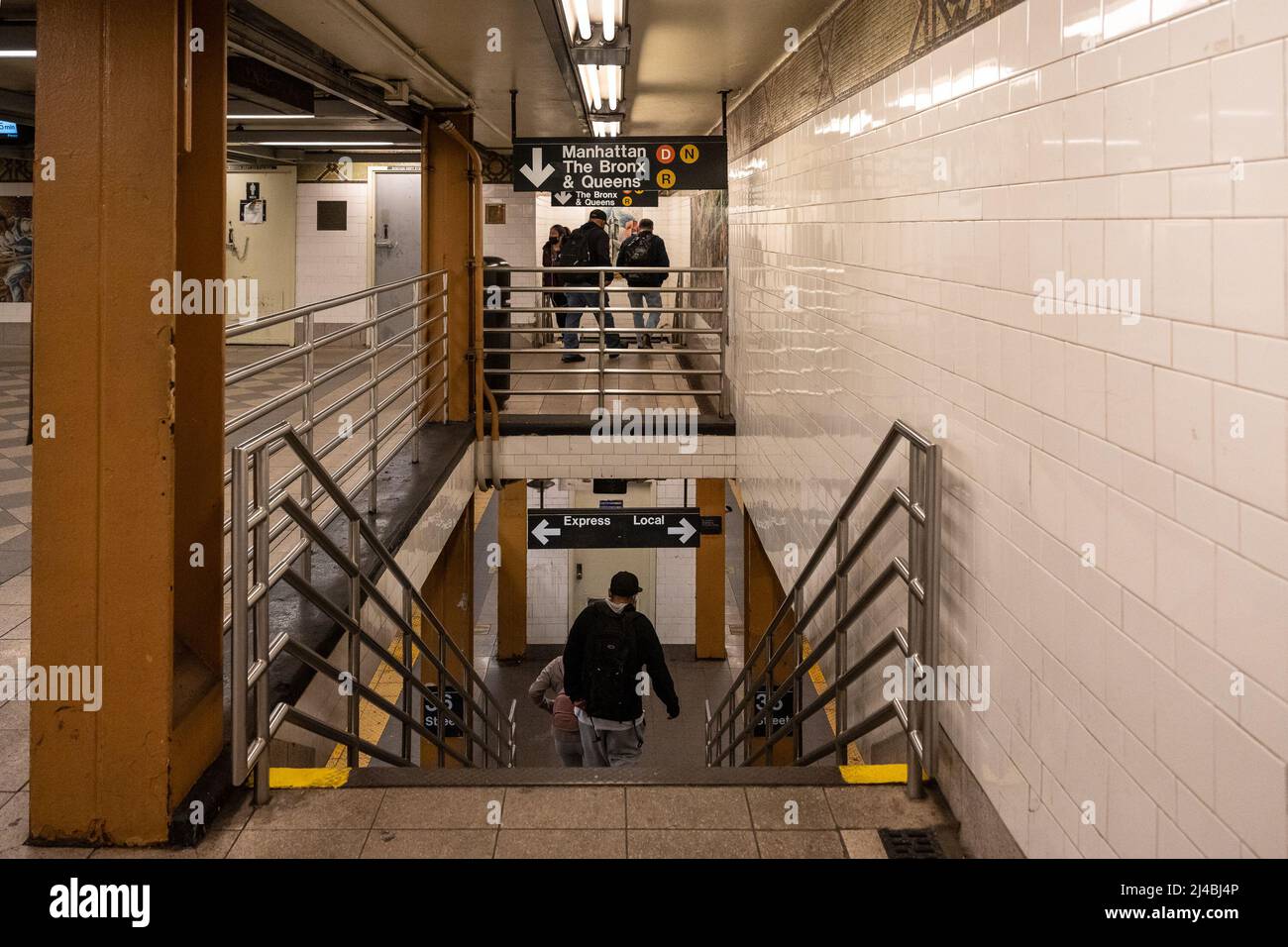 New York, USA. 13th Apr, 2022. Straphangers enter the Manhattan bound D ...
