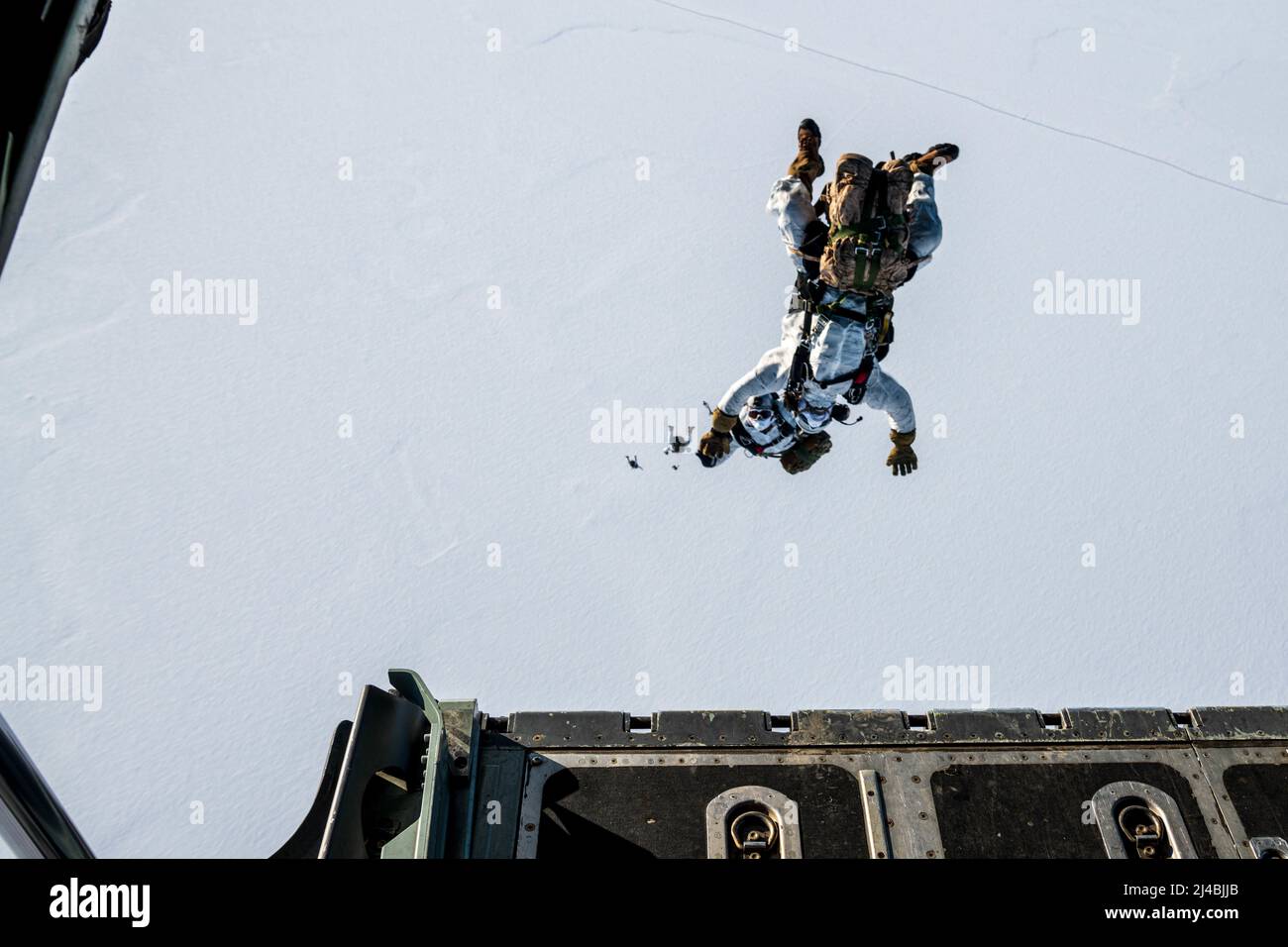 Naval Special Warfare members perform a high-altitude low-opening jump ...