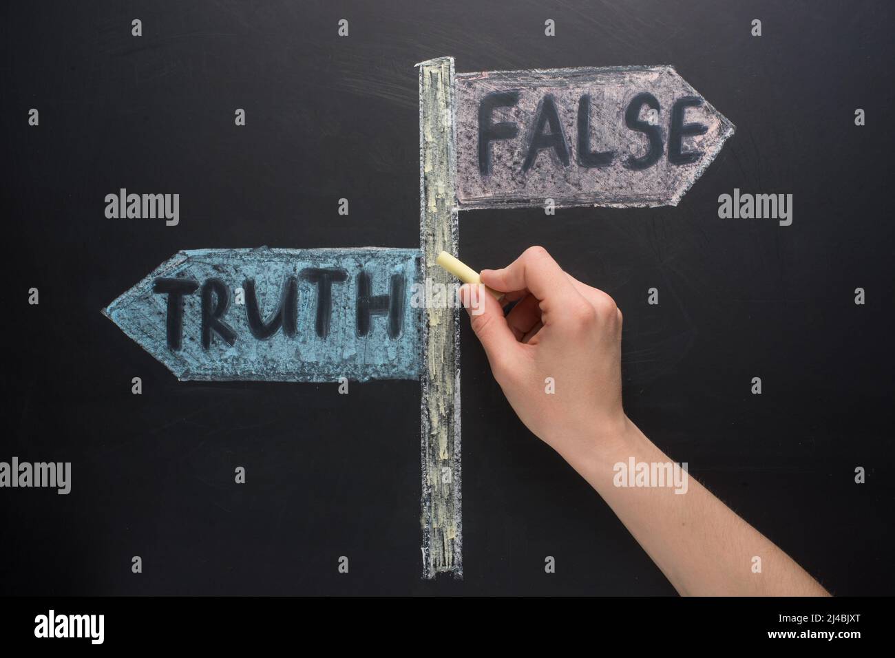 Arrows with truth and lies. The concept on the blackboard Stock Photo ...