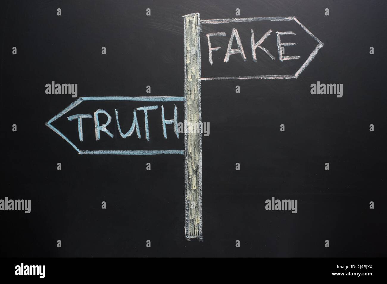 Arrows with truth and fake. The concept on the blackboard Stock Photo ...