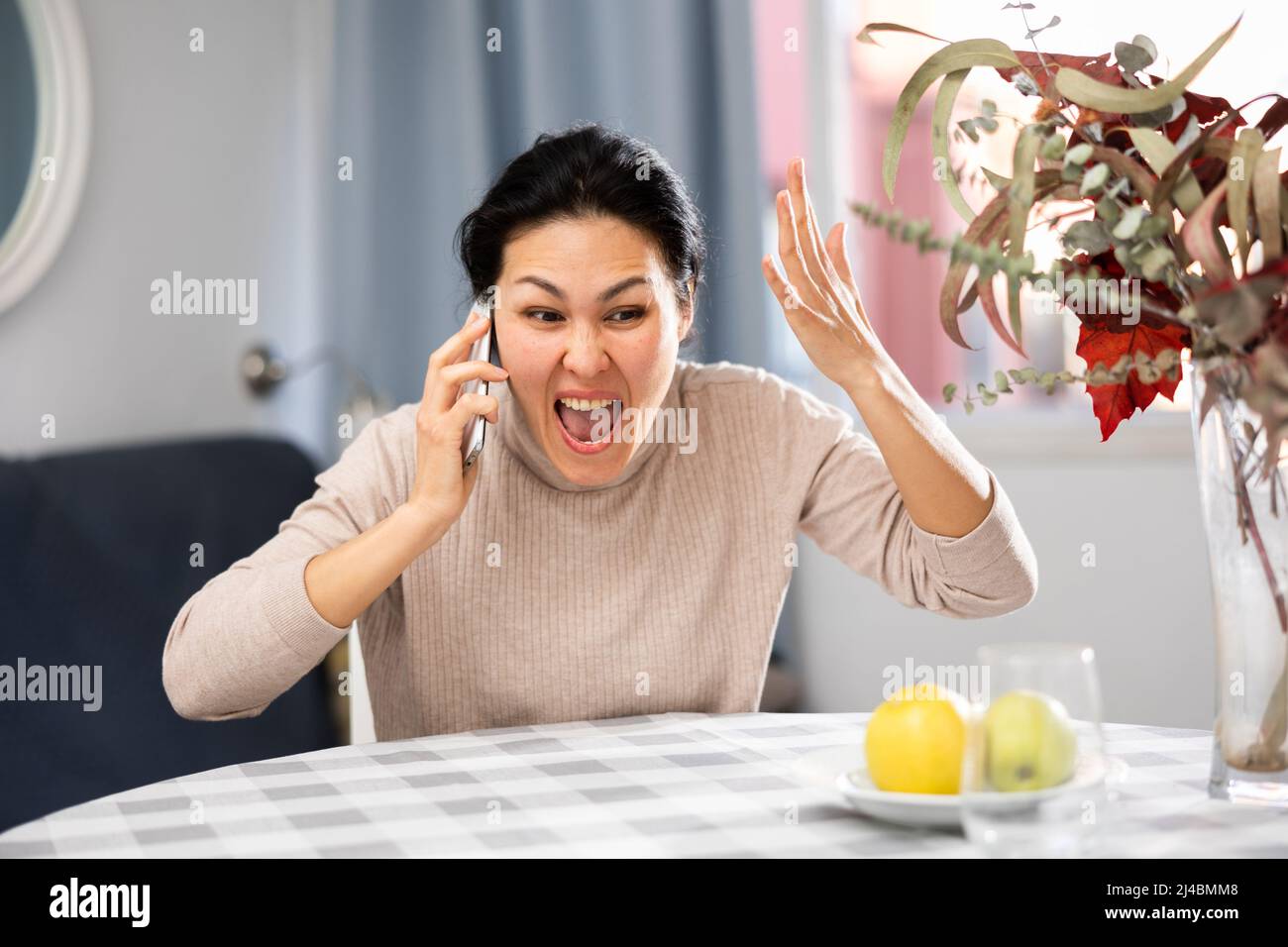 Angry asian woman shouting telephone hi-res stock photography and ...