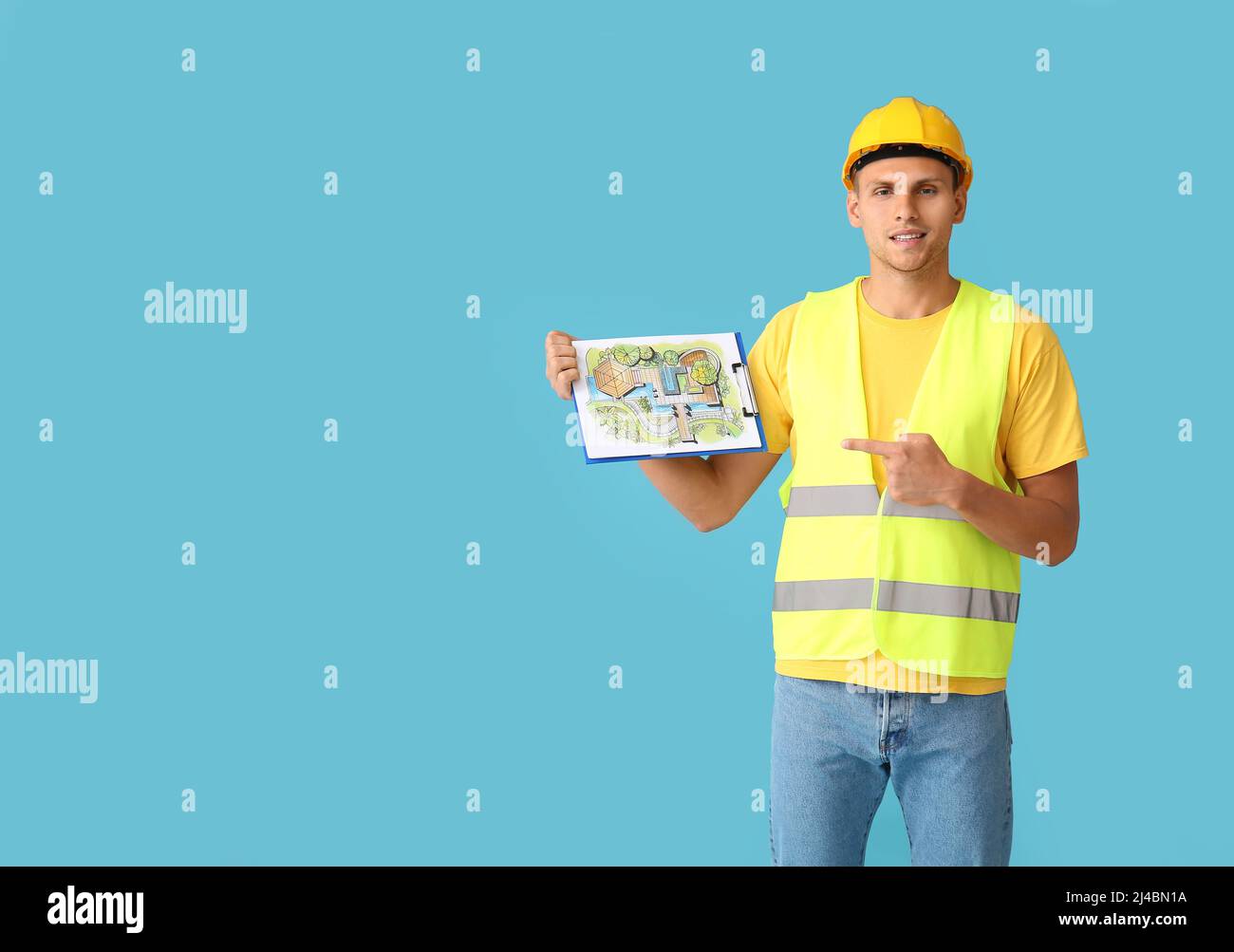 Young male landscape designer with new project on color background ...