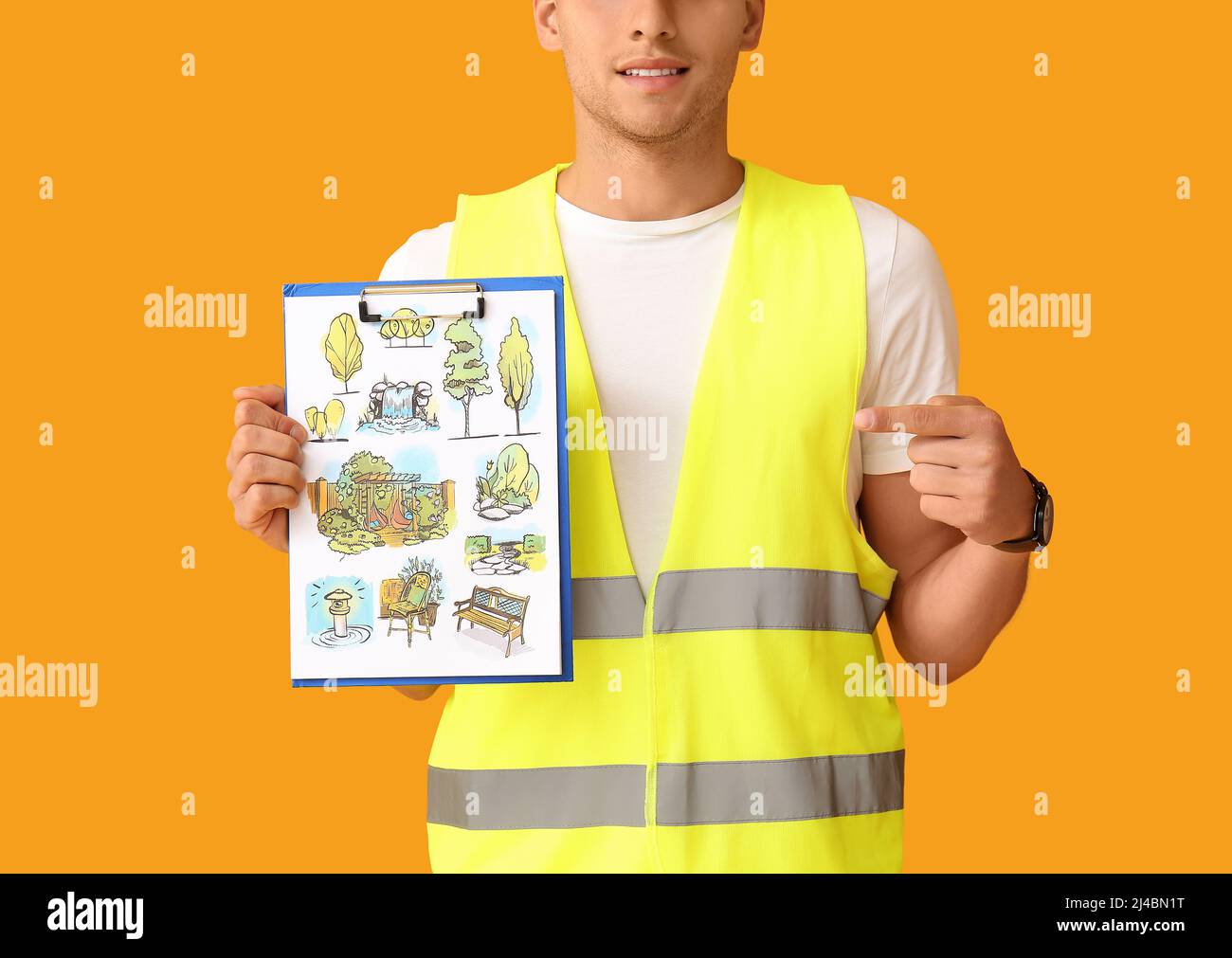 Young male landscape designer with new project on color background ...