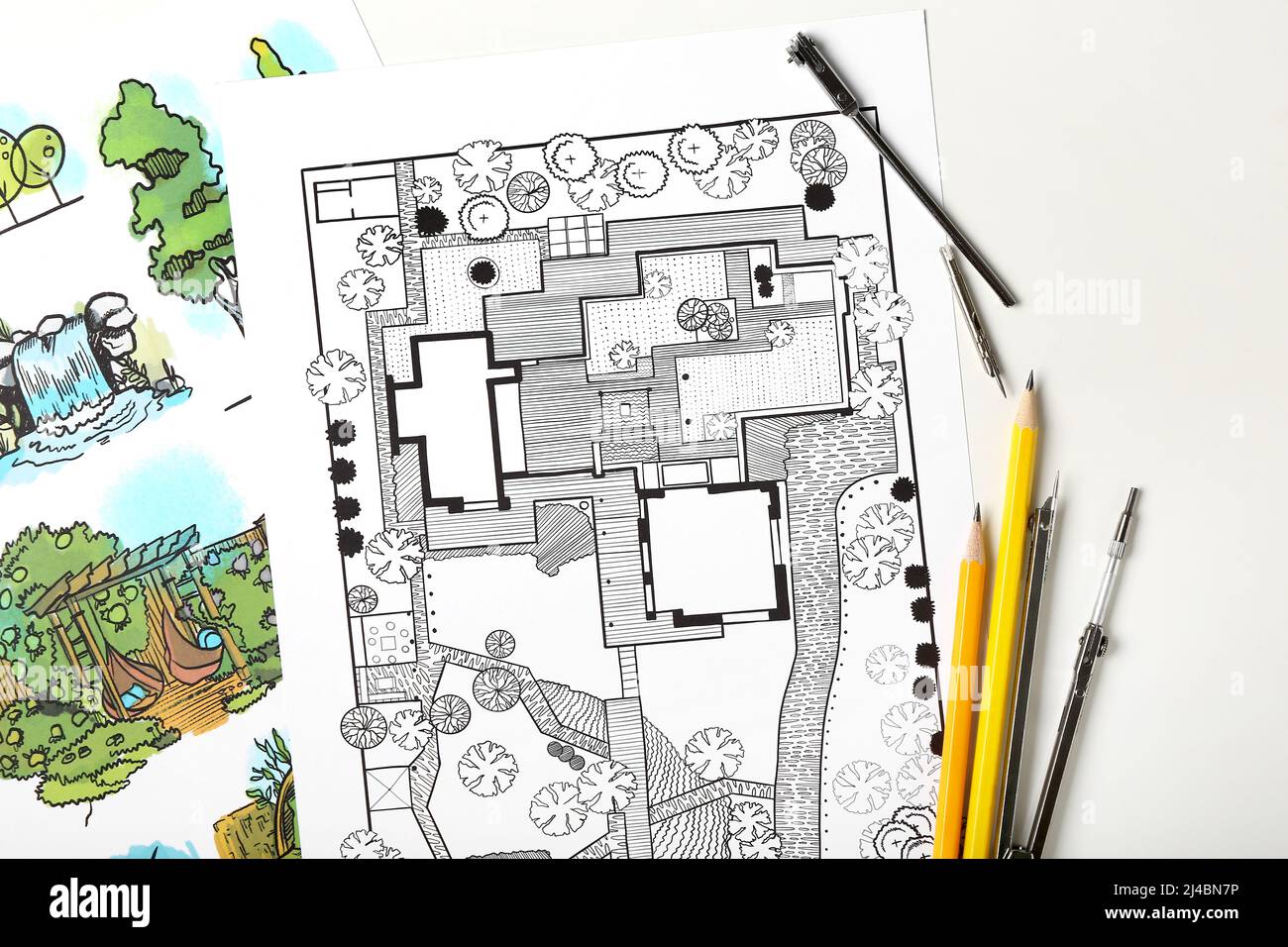 Paper sheets with sketches for landscape design and stationery on light ...