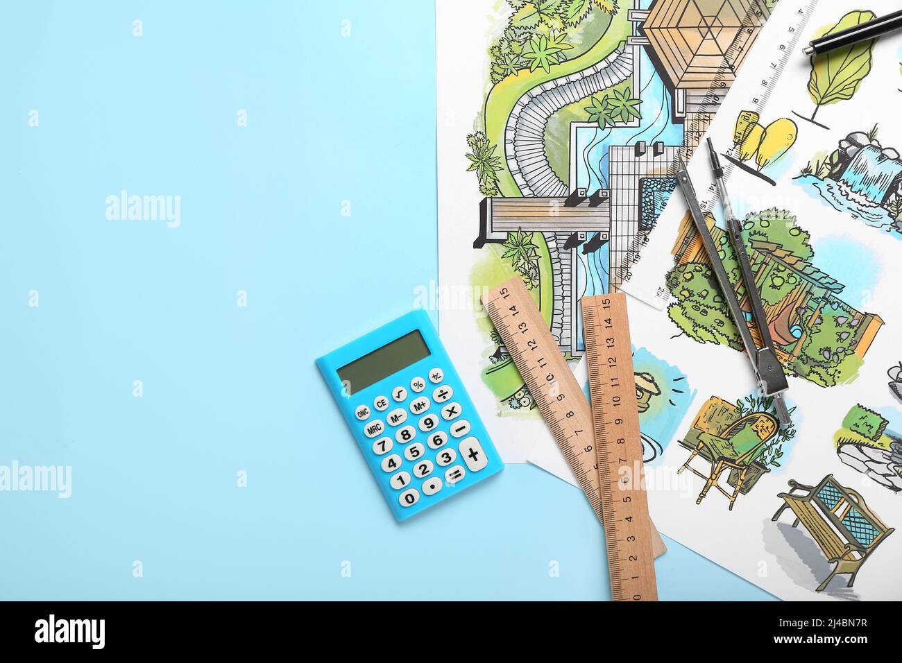 Landscape designer's plans with stationery and calculator on color ...