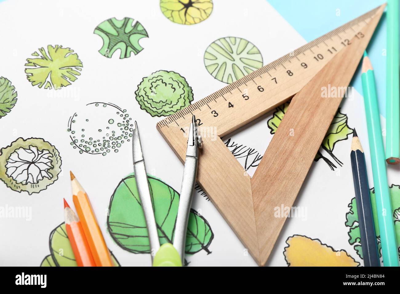 Paper sheet with sketches for landscape design and stationery on color ...