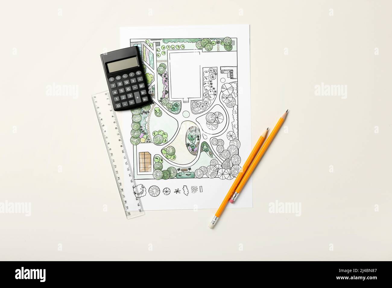 Landscape designer's plan with stationery and calculator on light ...