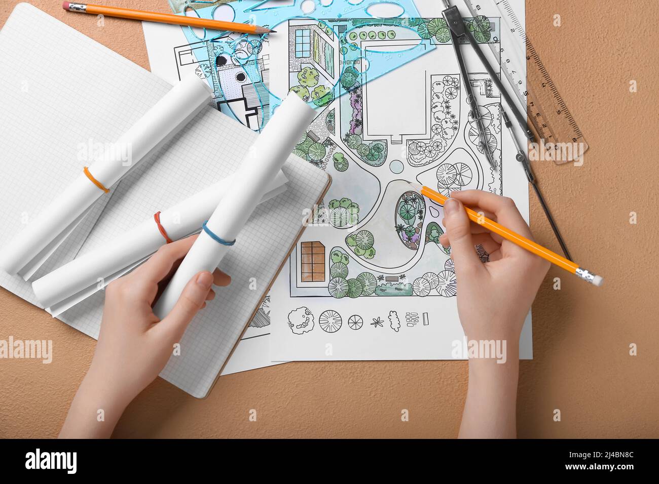 Landscape designer working on residential project, top view Stock Photo ...