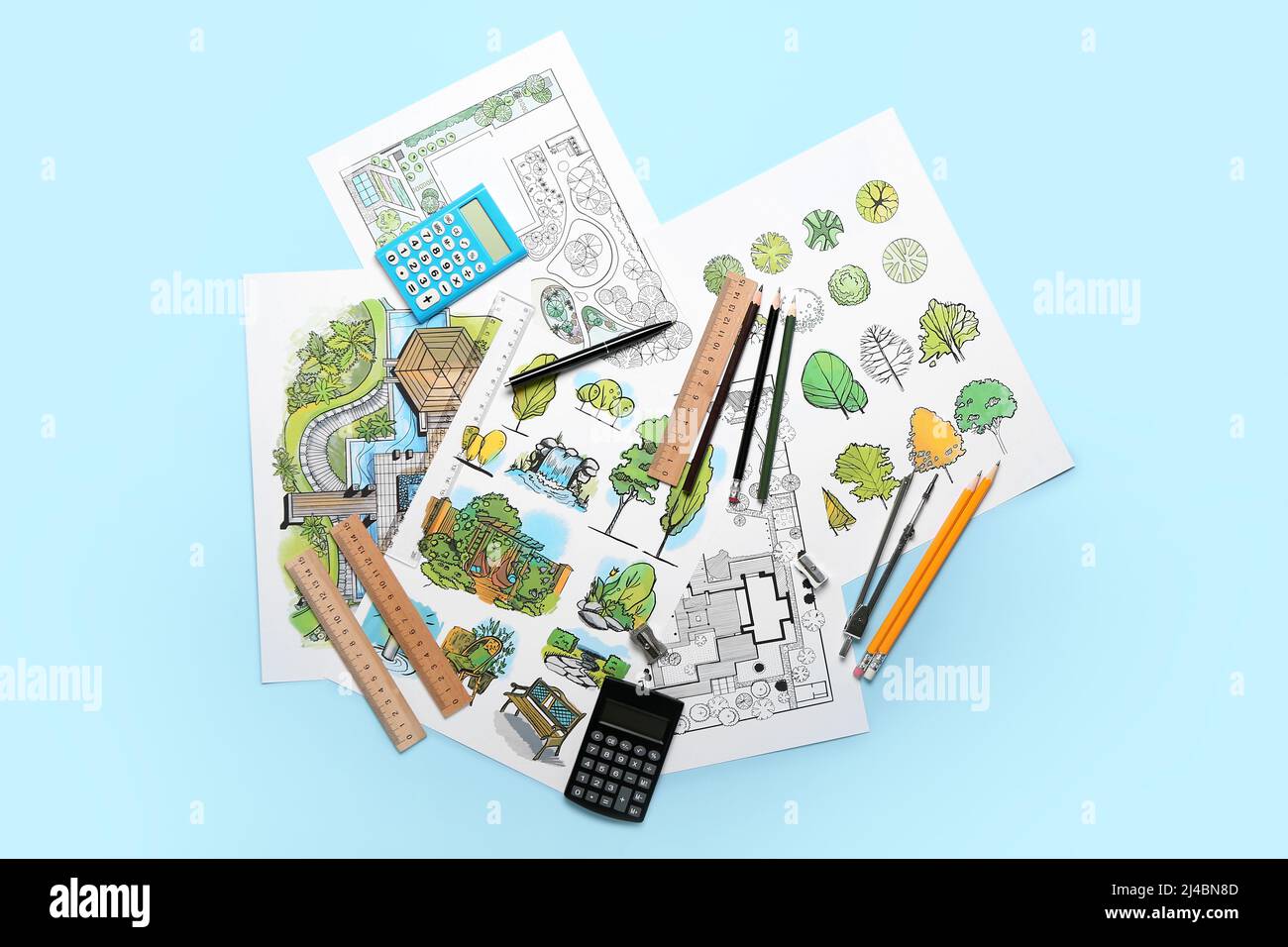 Paper sheets with sketches for landscape design and stationery on color ...