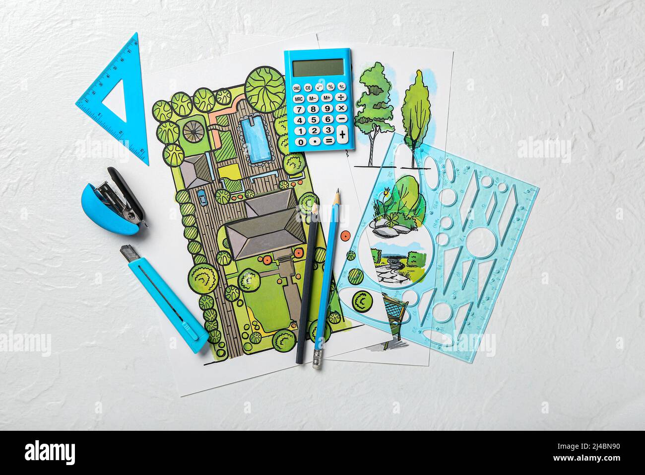 Paper sheets with sketches for landscape design and stationery on white ...