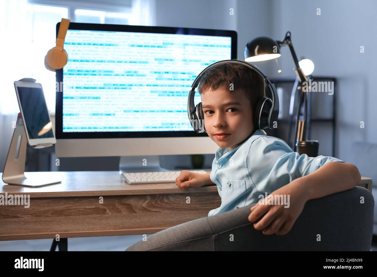 Cute little programmer using modern computer at home Stock Photo - Alamy