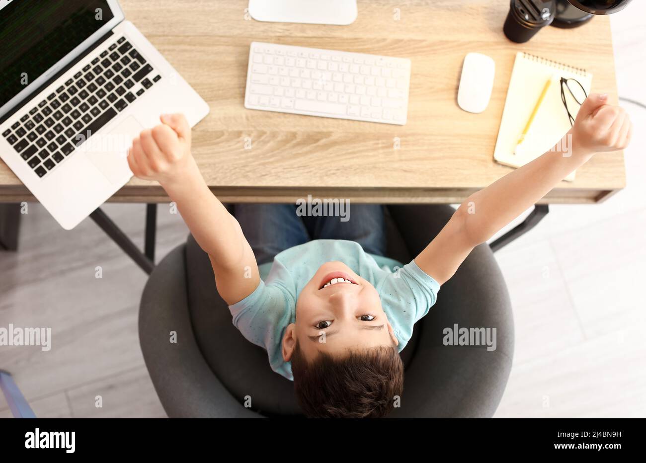 Happy little programmer working at home, top view Stock Photo - Alamy