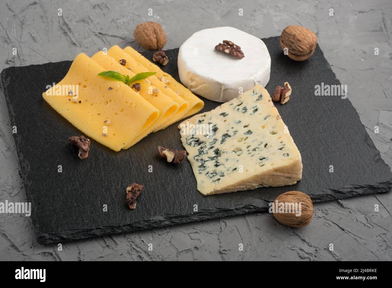Different cheeses on black hi-res stock photography and images - Alamy