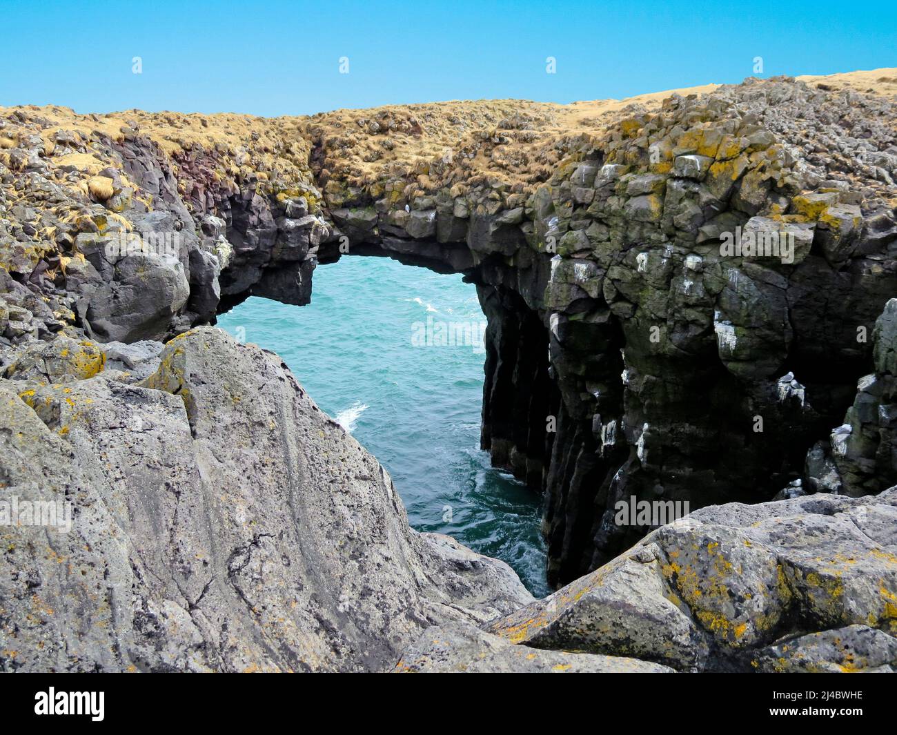 The stone bridge. Arnarstapi. Snaefellsnes peninsula. Iceland Stock ...