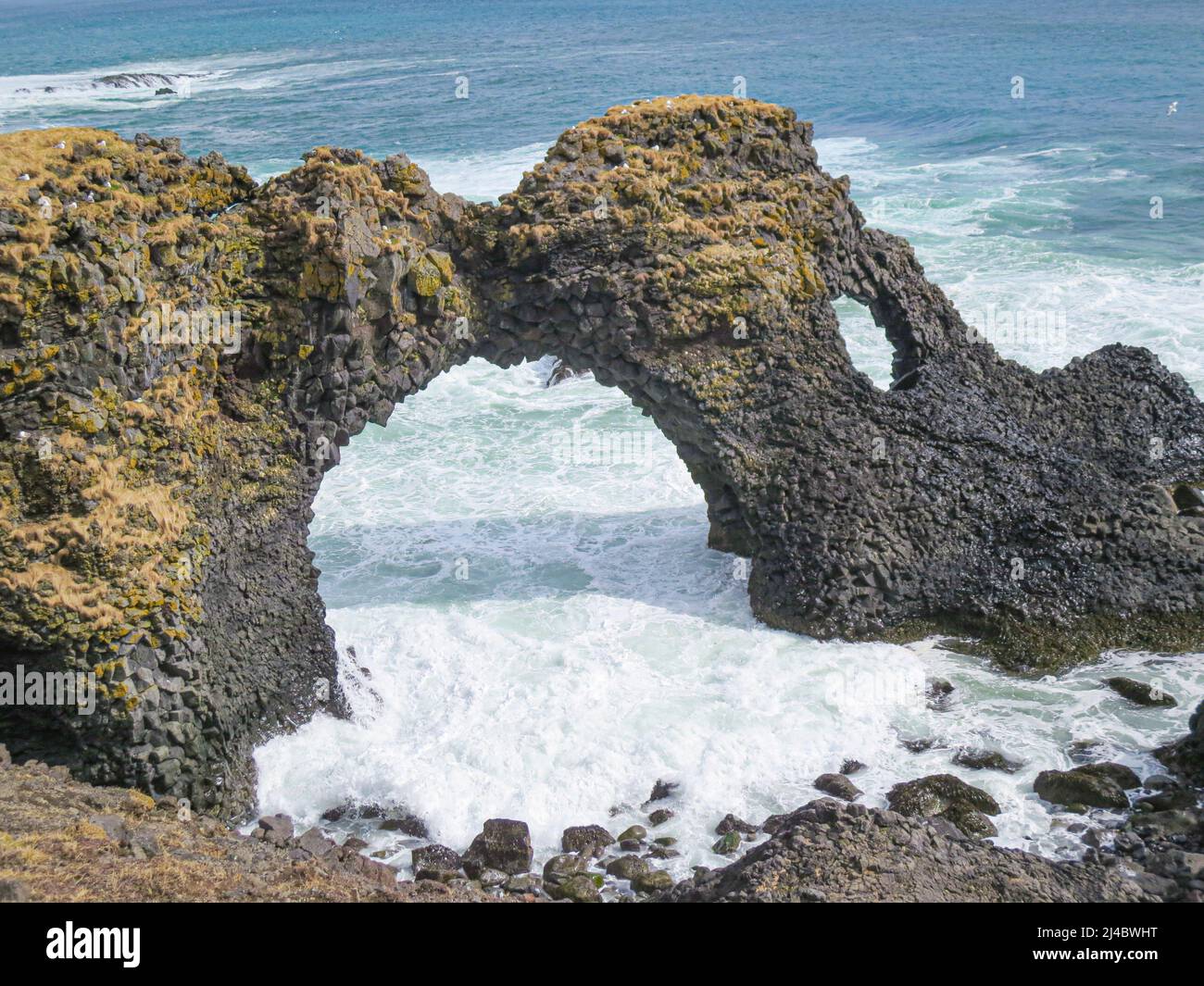 The stone bridge. Arnarstapi. Snaefellsnes peninsula. Iceland Stock ...