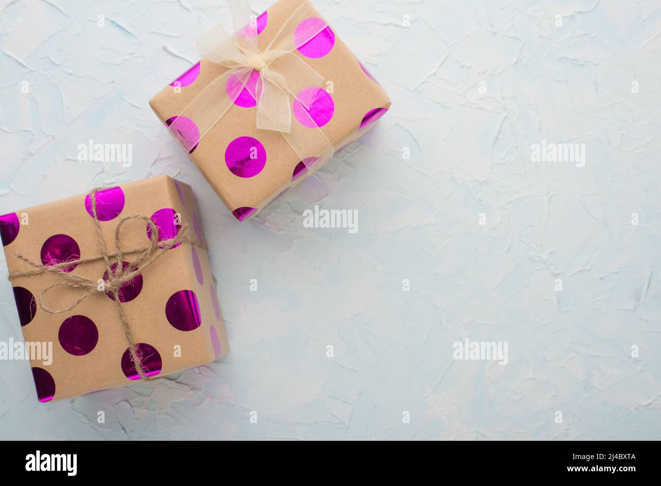 Two gifts on a light background with an empty space for writing or ...