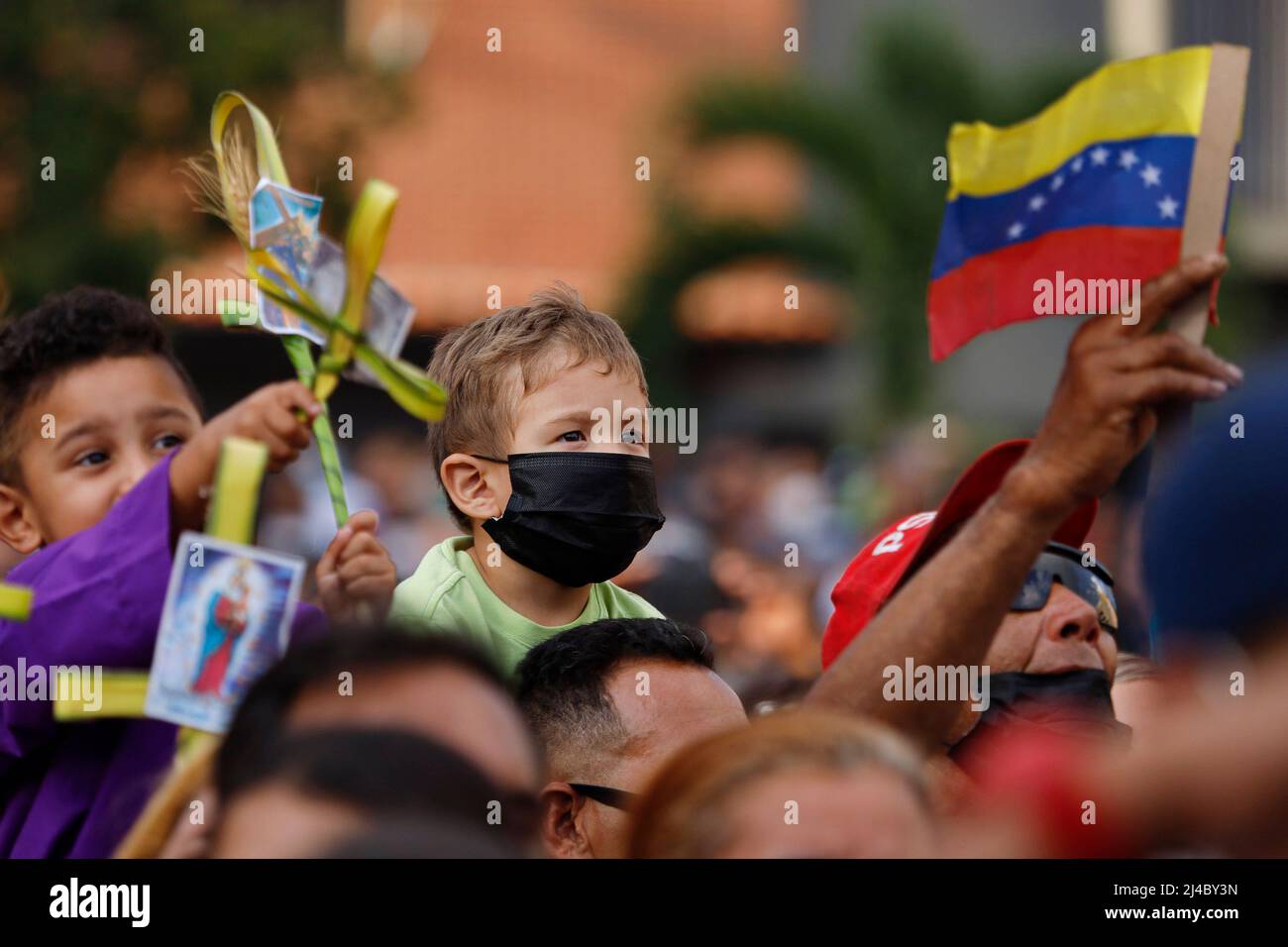 Caracas, Venezuela. 13th Apr, 2022. People follow the procession of the ...