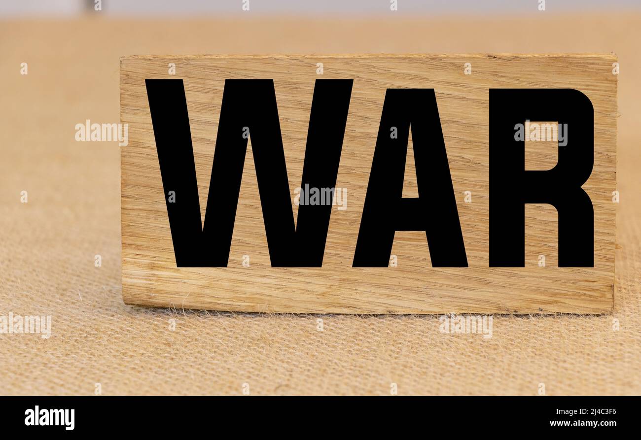 War text written on a piece of wood concept Stock Photo - Alamy