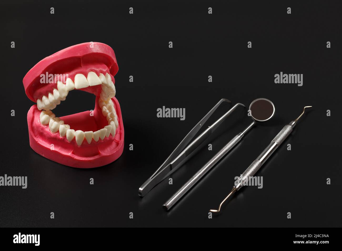 Set of metal instruments for dental treatment with a layout of the ...