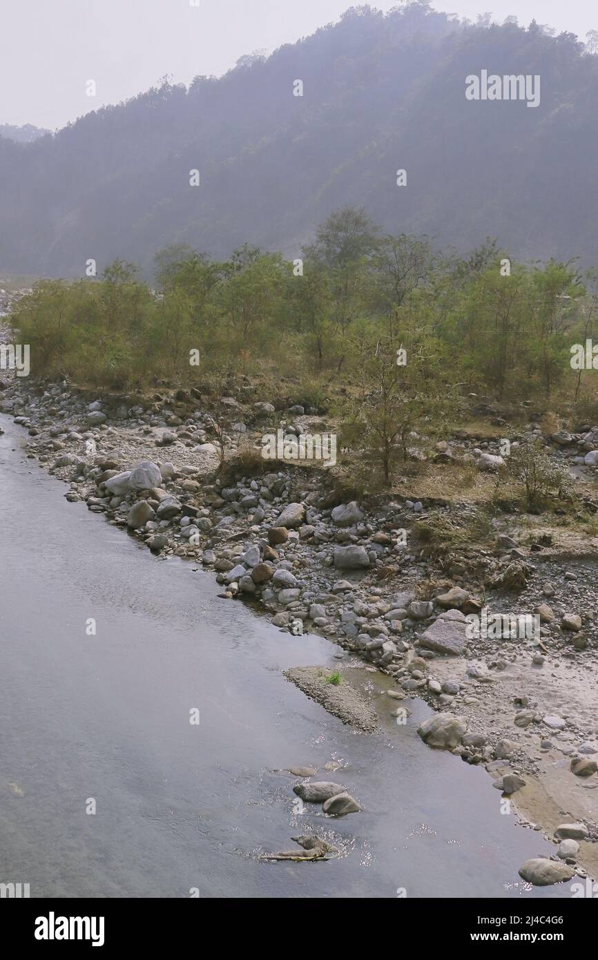 balason river is flowing through the boulders covered terai region at ...