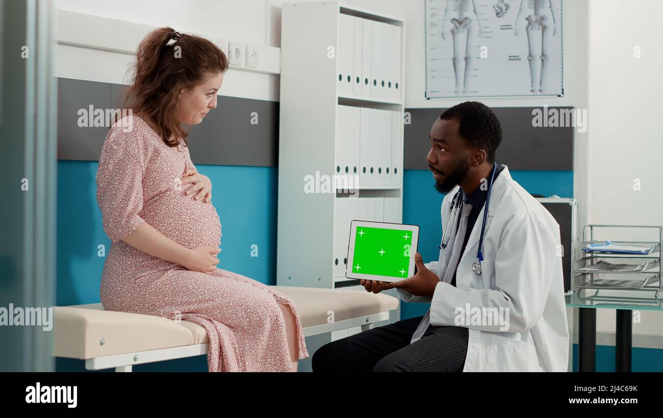 Physician holding horizontal greenscreen hi-res stock photography and ...