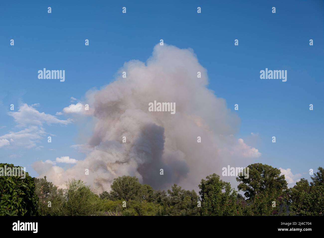Building fire among fields and huge smoke cloud Stock Photo - Alamy