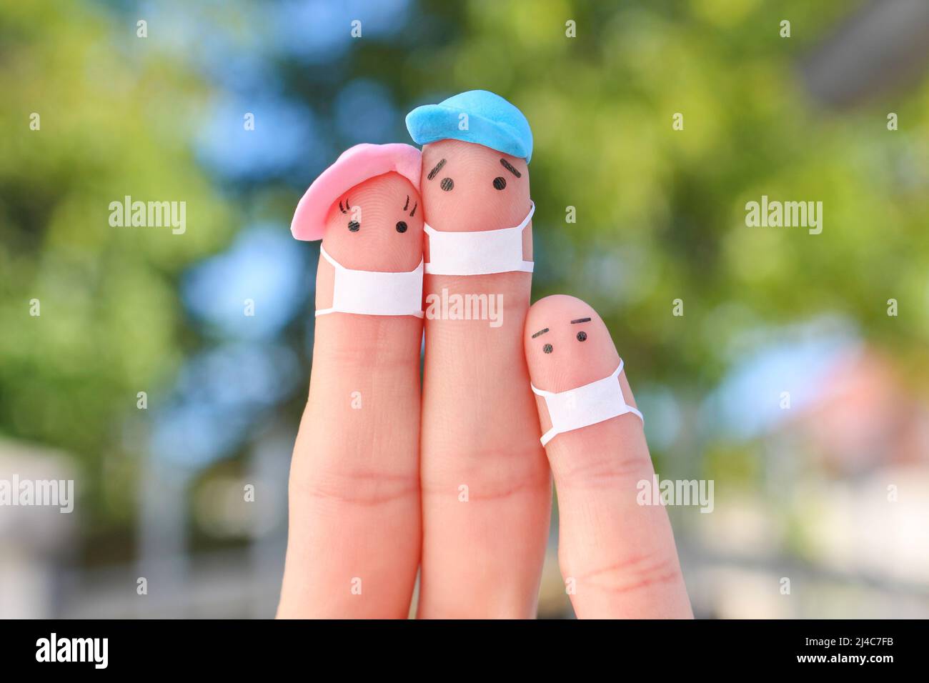 Fingers art of family with face mask Stock Photo - Alamy