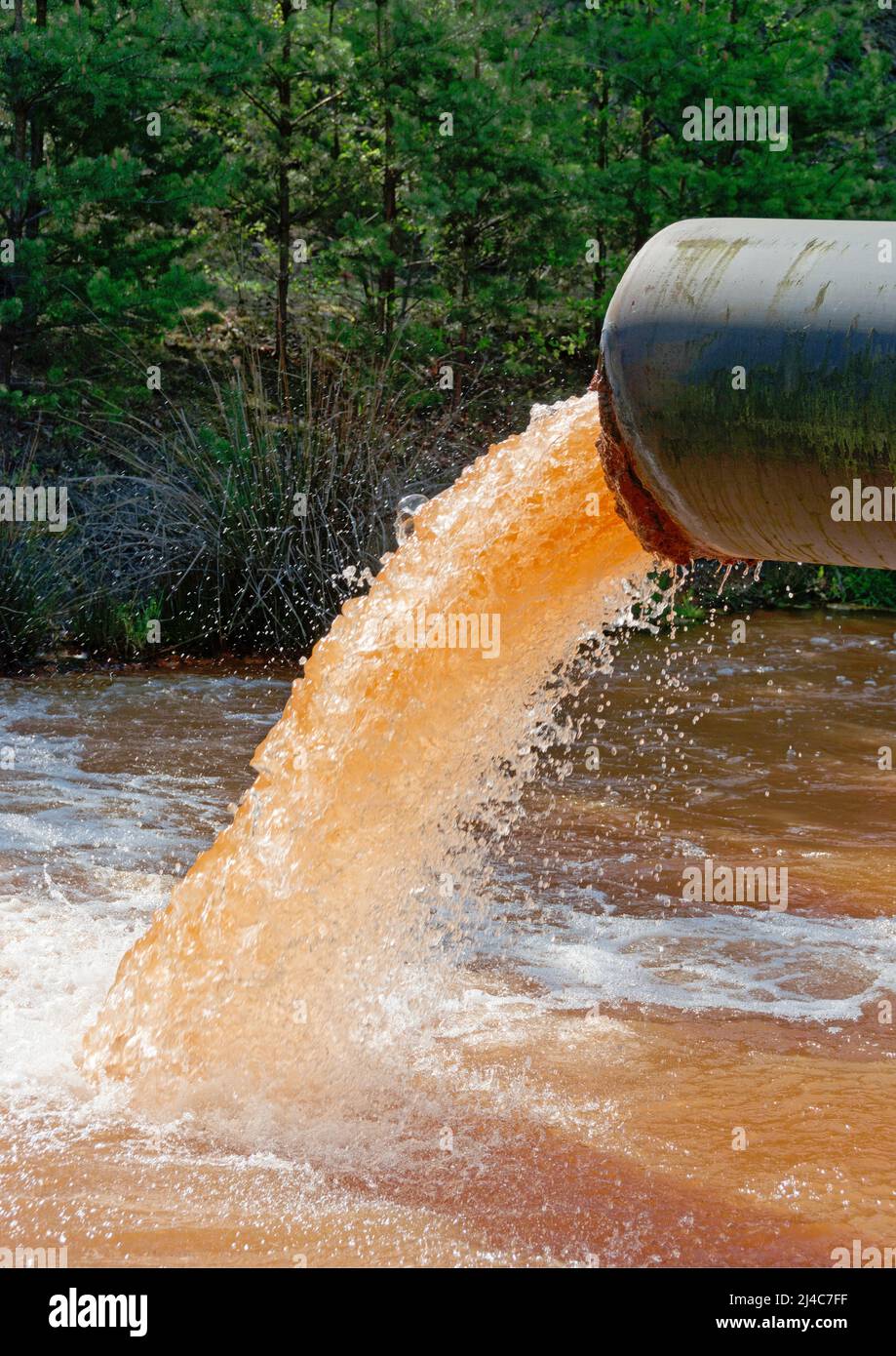 Wastewater is discharged into the river, portrait format Stock Photo ...