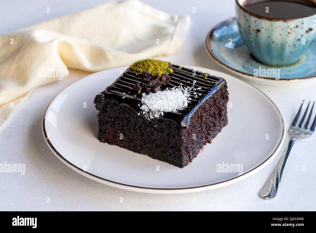 Chocolate moist cake. Wet cake in a plate. Bakery products. Close-up ...