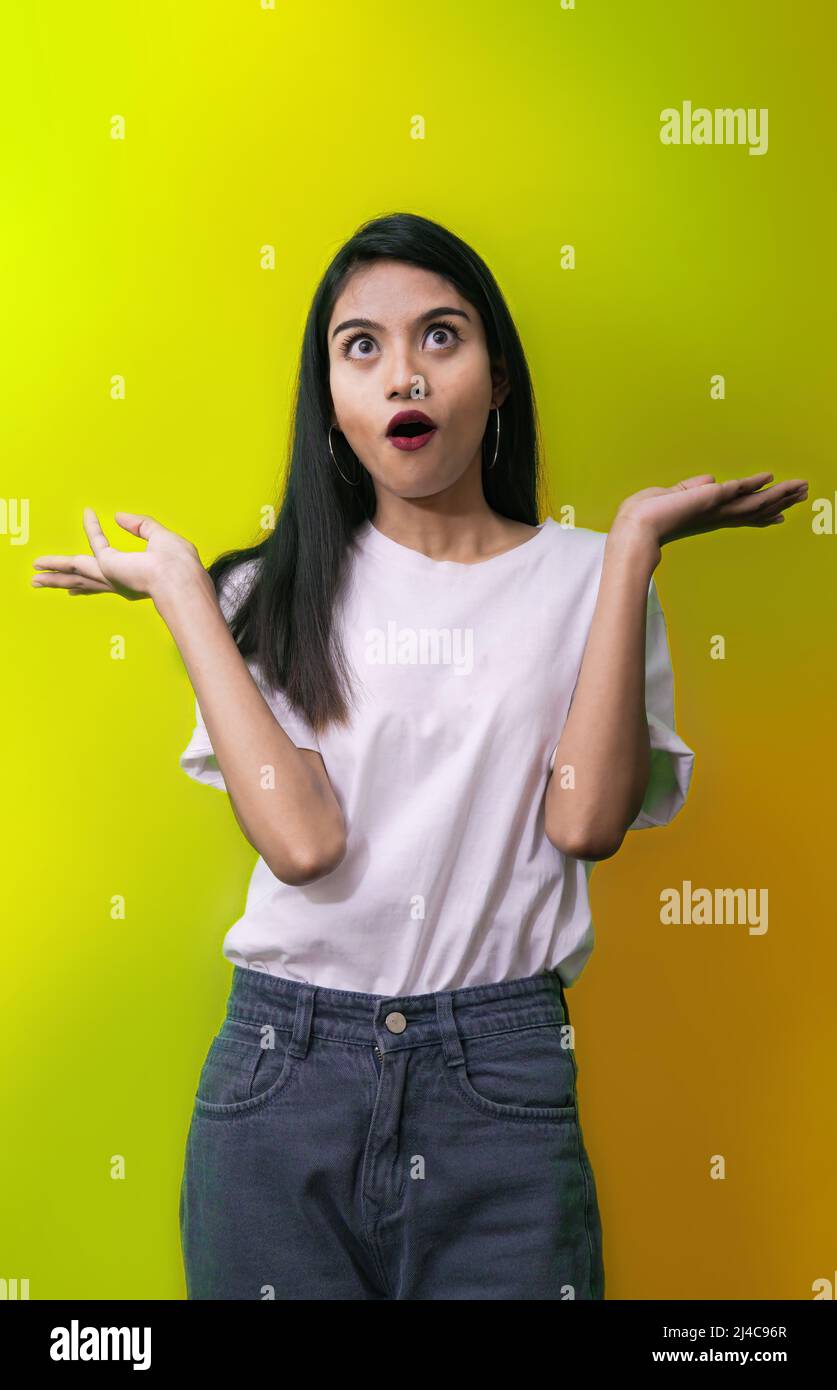 Advertisement concepts woman hands up. Excited happy Confused Indian ...
