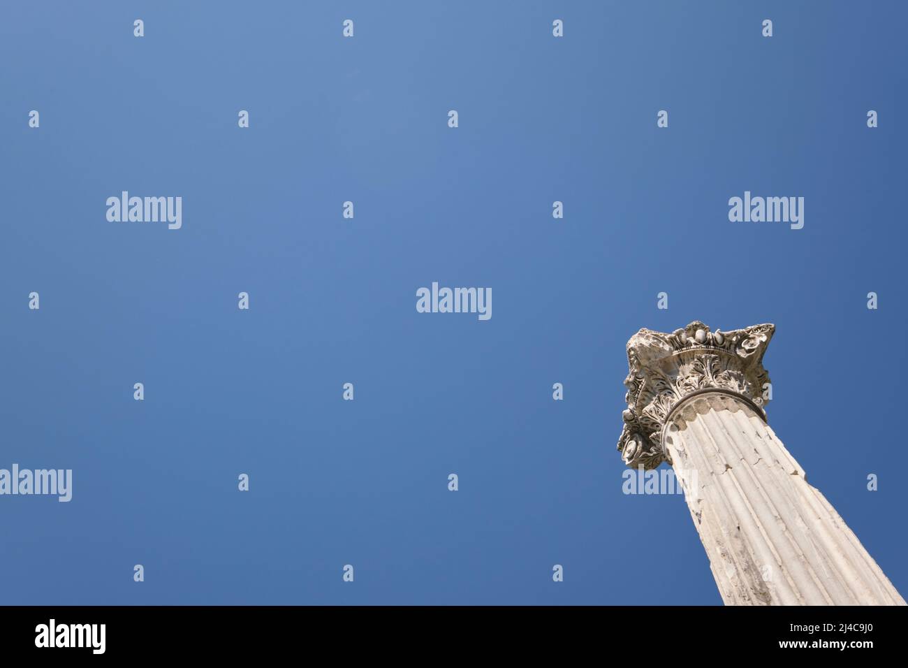 Abstract, graphic look at a column corinthian cap soaring, reaching to ...