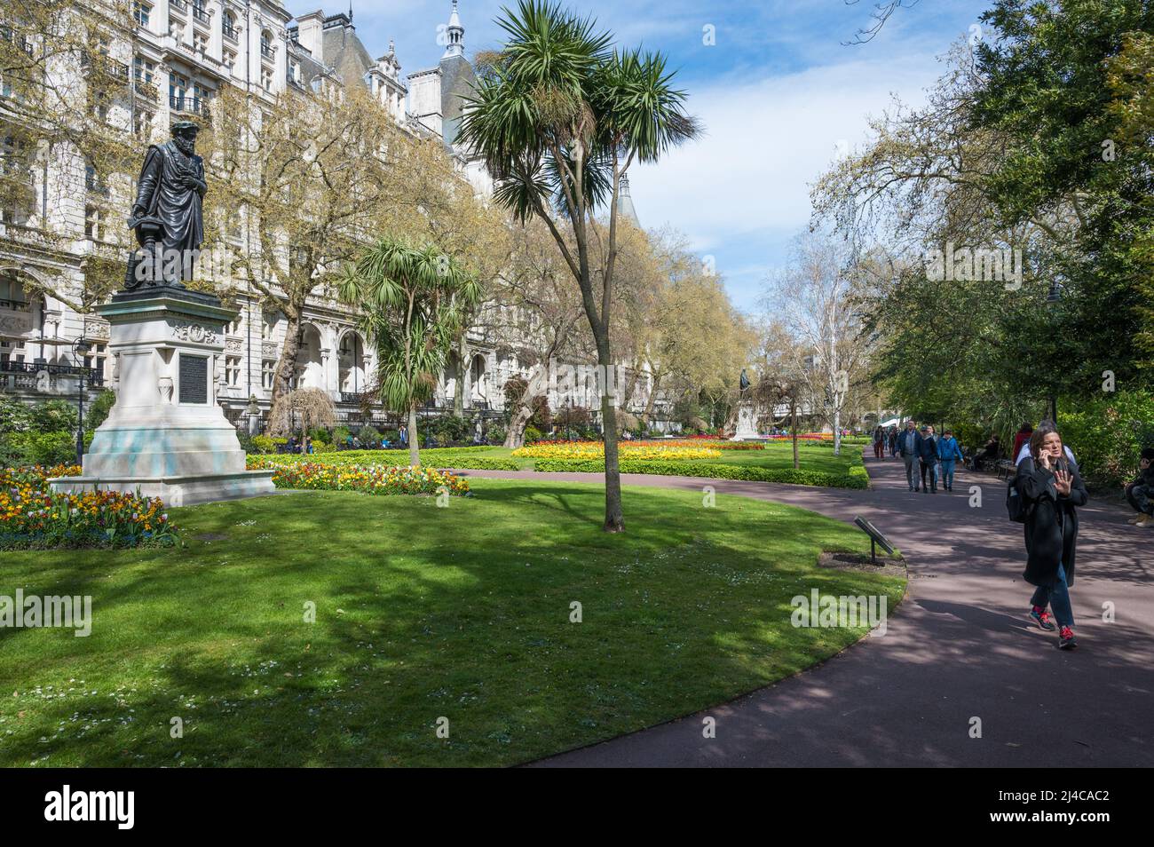 People out and about in Victoria Embankment Gardens on a warm sunny ...