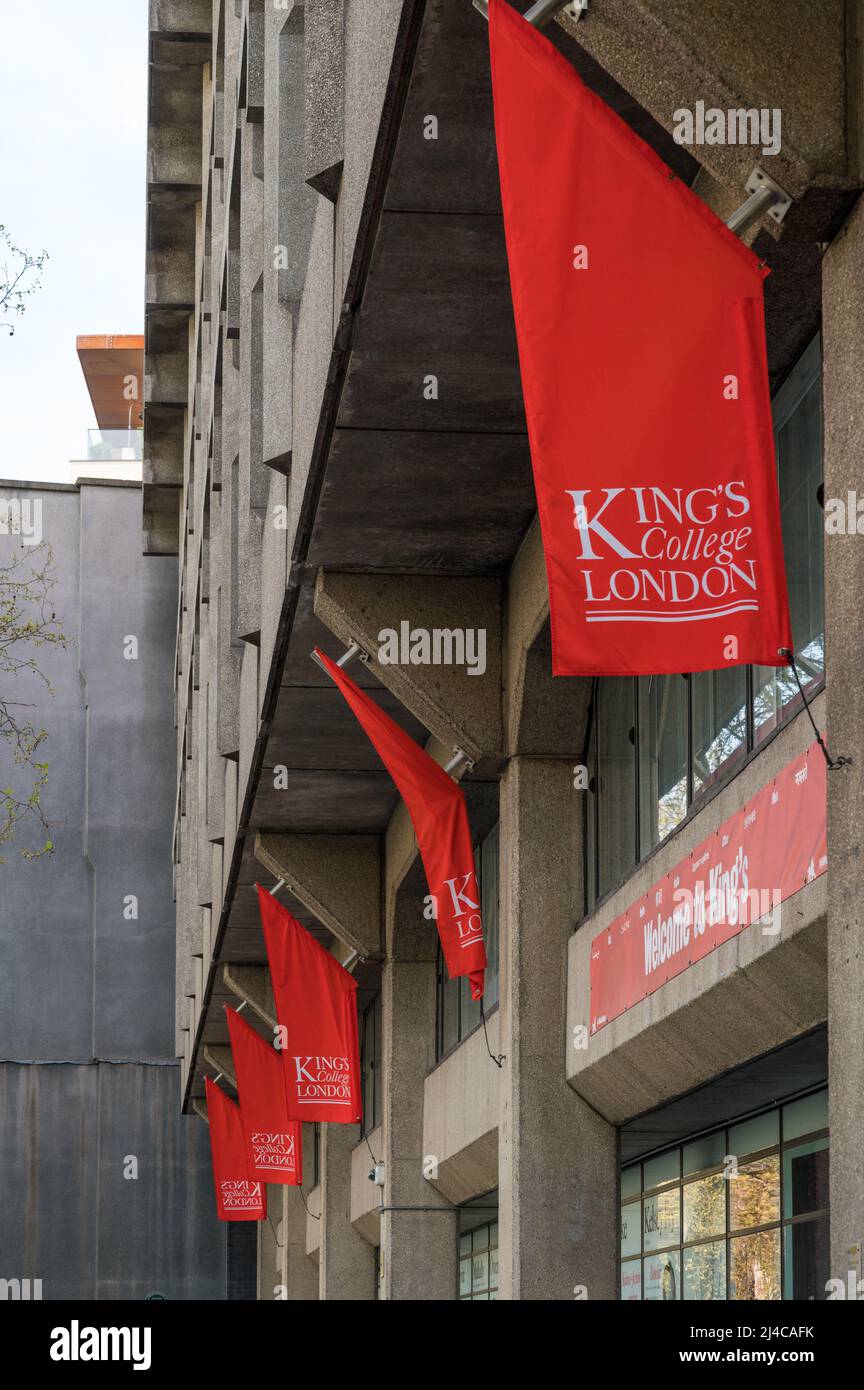 Bright red banners mounted on the facade of Kings College London ...