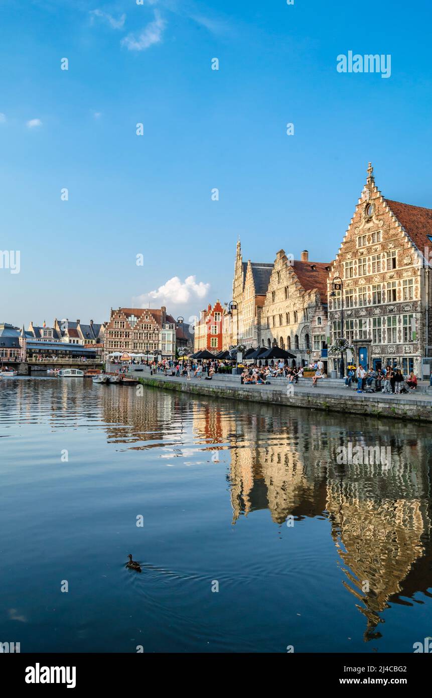 GHENT, BELGIUM - AUGUST 20, 2013: Urban landscape, people enjoying a ...