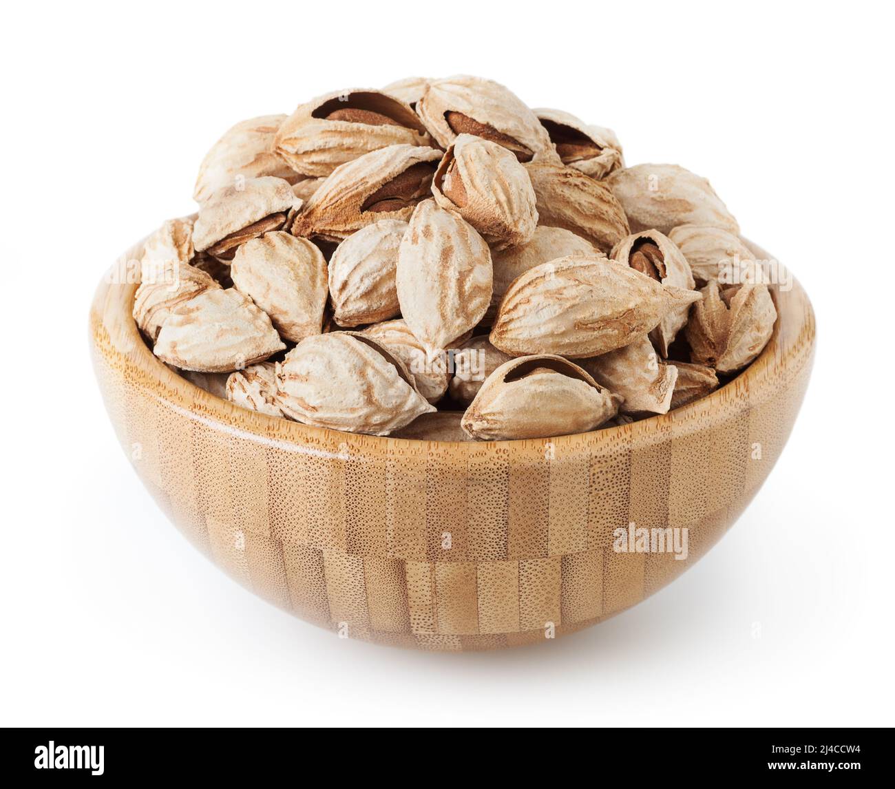 Almonds in wooden bowl isolated on white background with clipping path ...