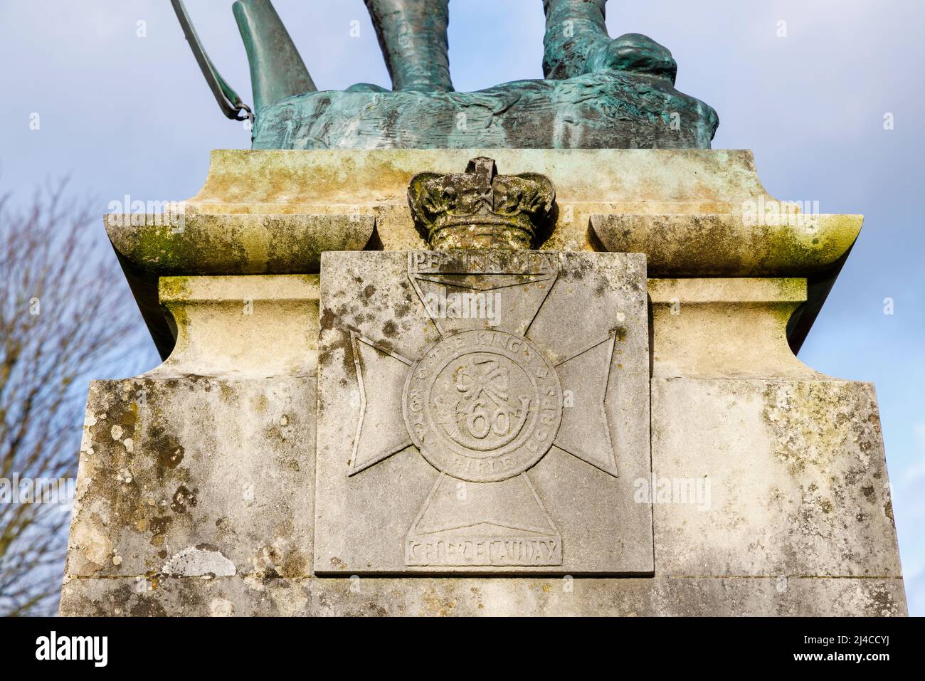 Crest on the base of the commemorative memorial bronze statue of a ...