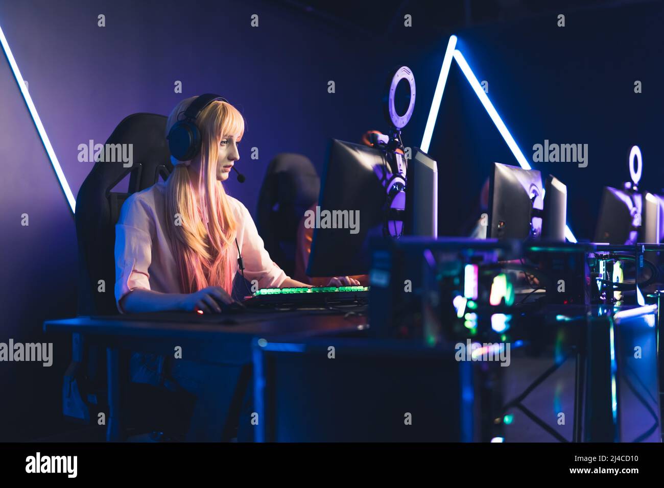 blonde European girl playing in gaming tournament medium full shot ...