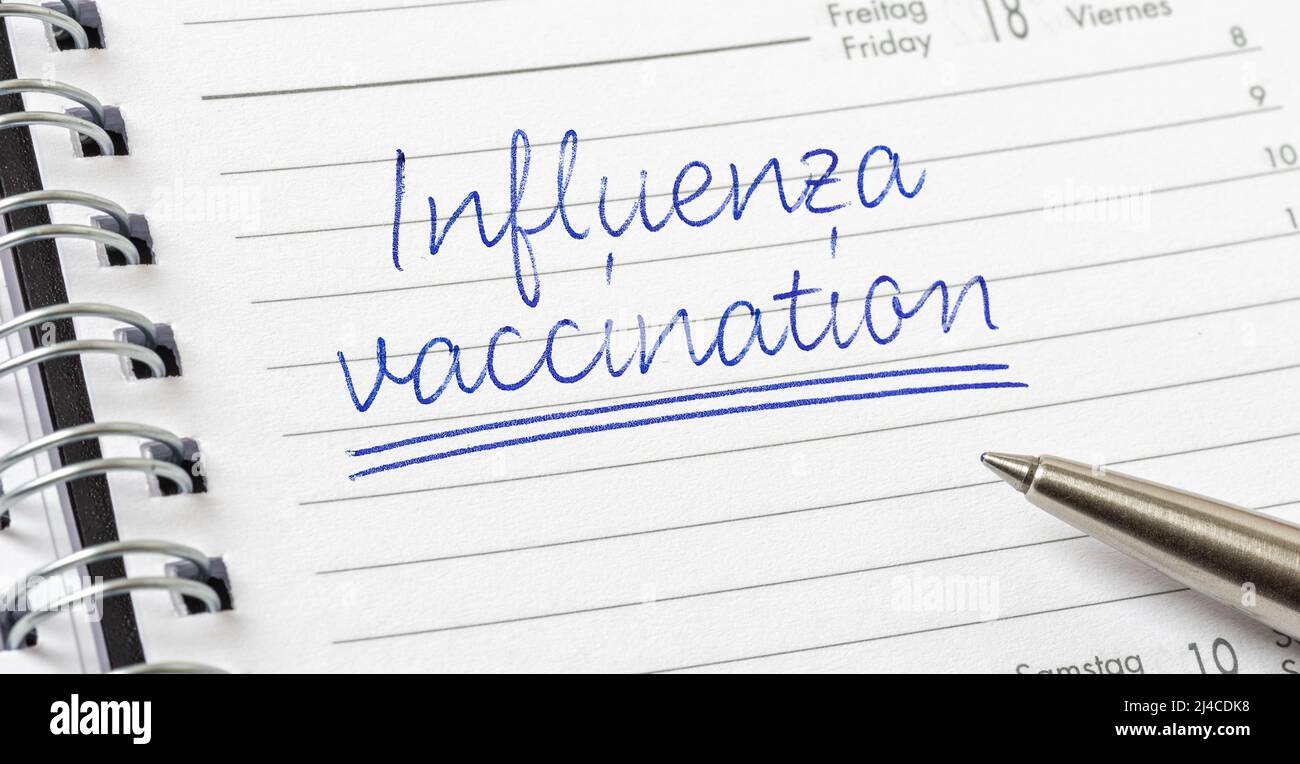 Influenza Vaccination written on a calendar page Stock Photo - Alamy