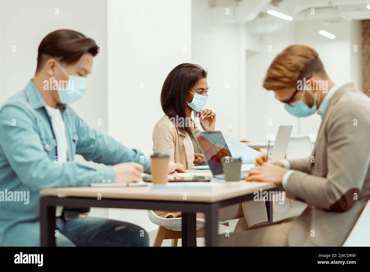 Smiling successful businessmen sitting table hi-res stock photography ...